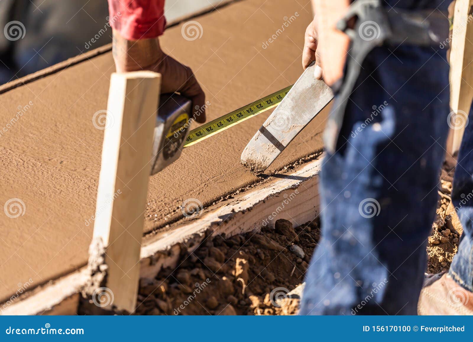 Cement Construction Worker Using Measuring Tape while Forming Pool ...