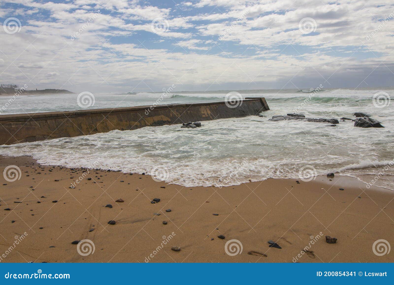 Cement Jetty Leading from Shoreline into Rough Sea Stock Image - Image ...
