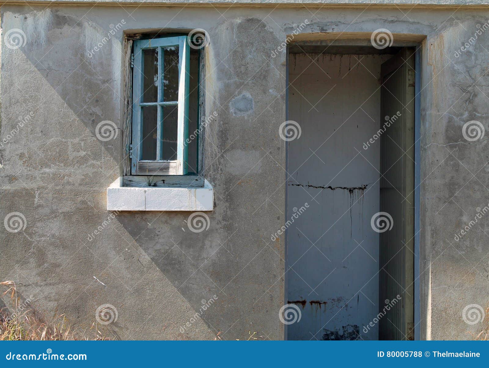 Cement Outbuilding with Open Window and Missing Door Stock Photo ...