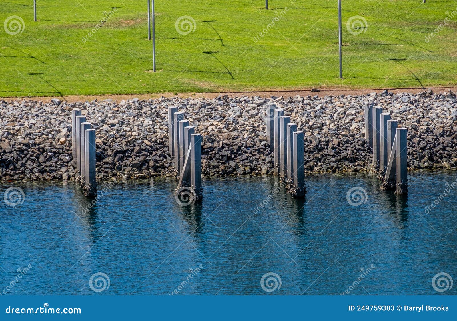 Cement Pilings in Harbor stock image. Image of pilings - 249759303
