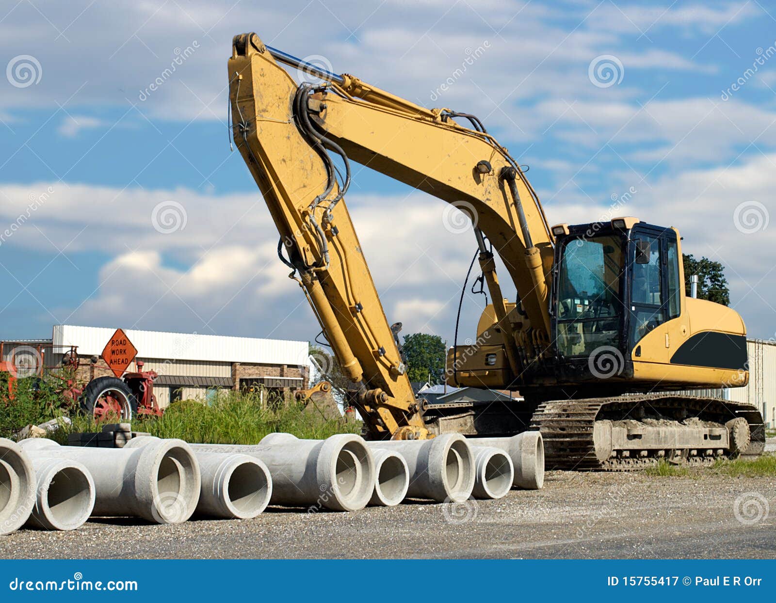 Cement pipes with backhoe stock image. Image of concrete - 15755417