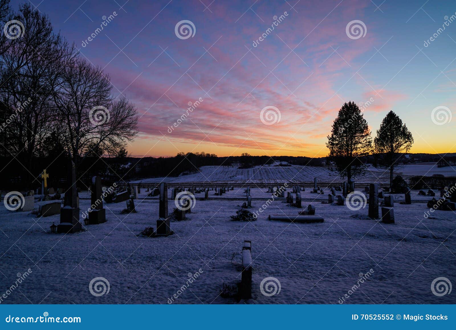 Cemetery At Sunset, With The Sun Setting Behind A Row Of Headstones ...