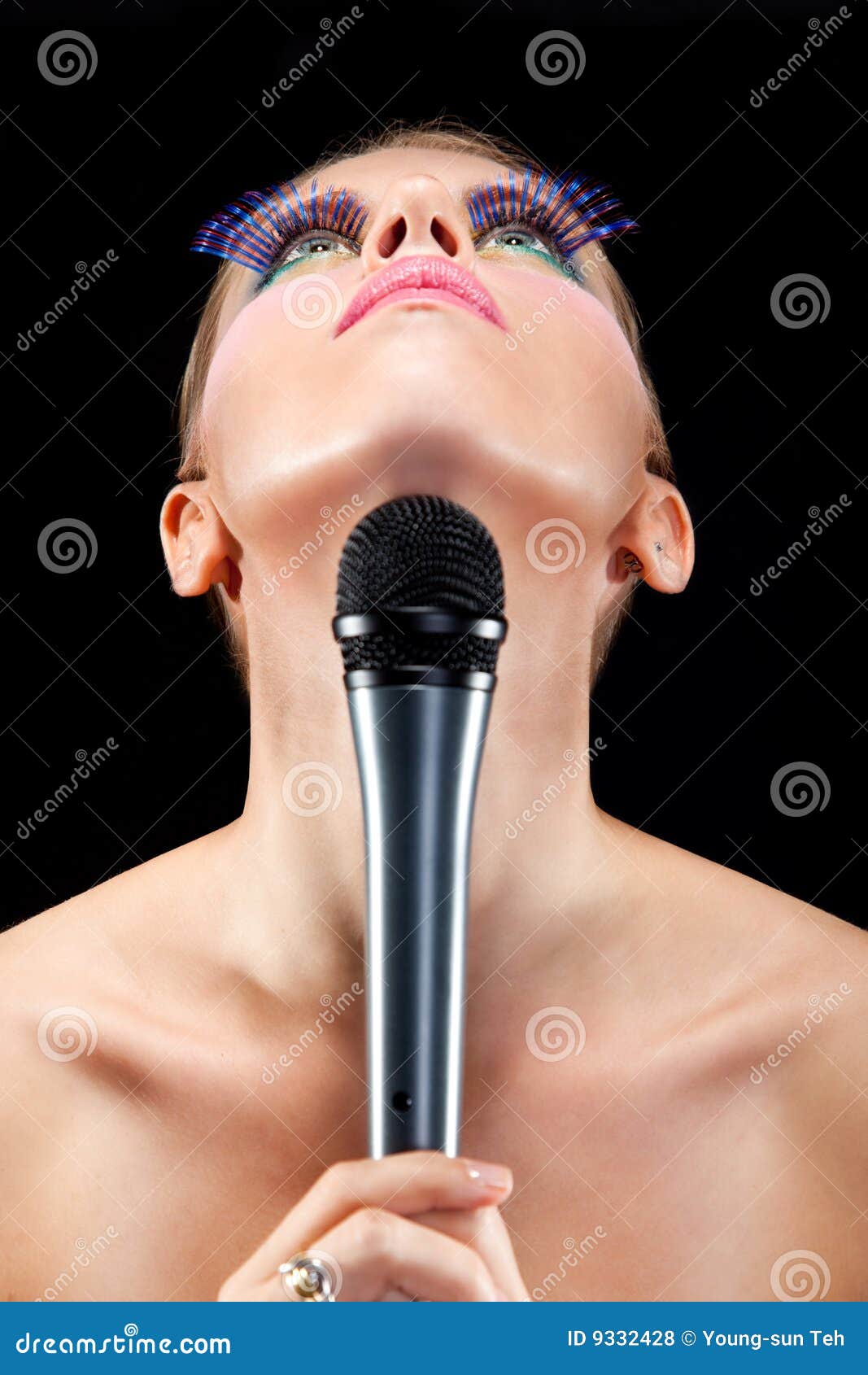 Cemetrical Composition of a Female Singer and Mic Stock Photo - Image ...