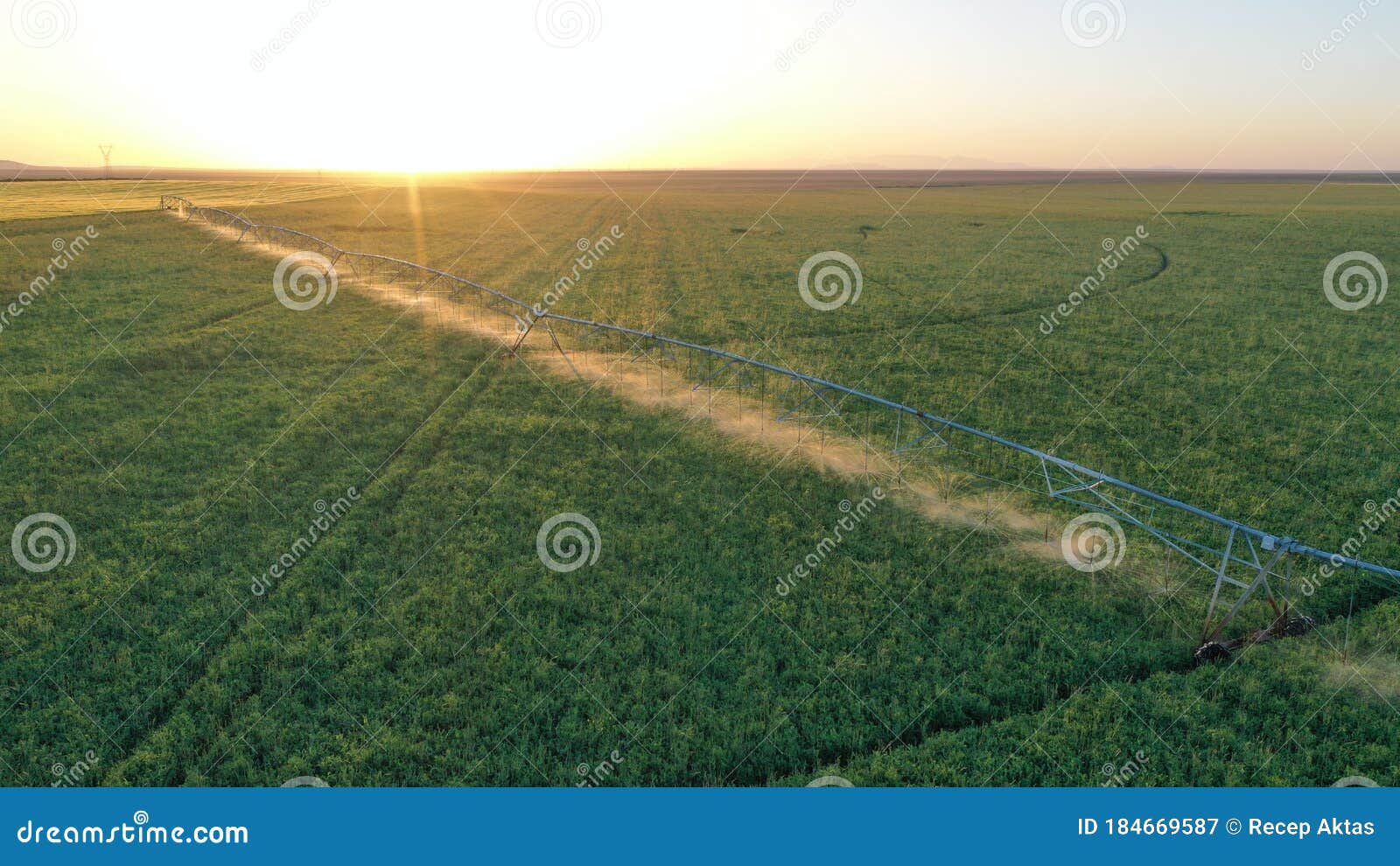 Center Pivot Irrigation System in Field at Sunset. Aerial View Stock ...