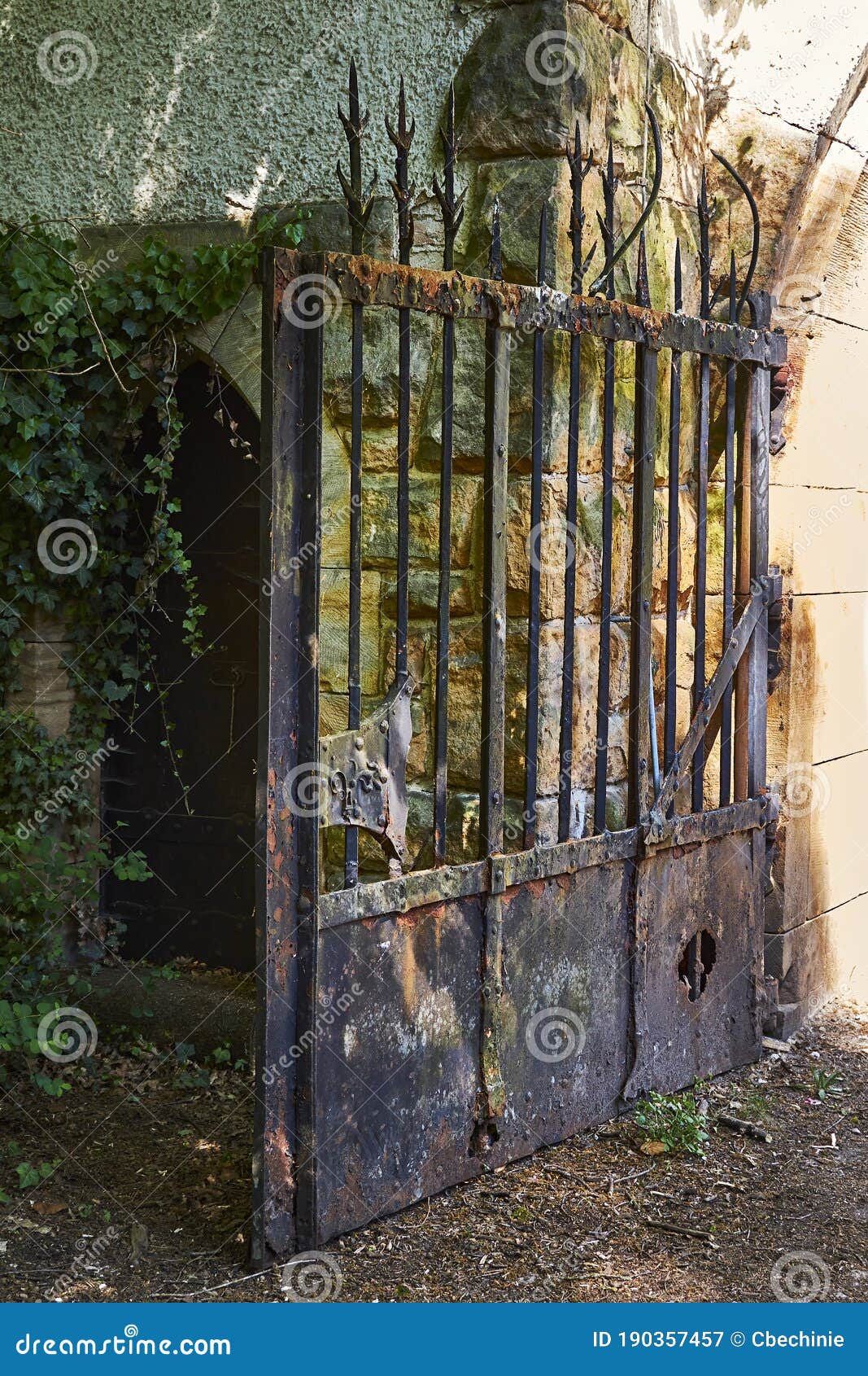 In the Center You Can See a Rusty Wrought-iron Gate Stock Image - Image ...