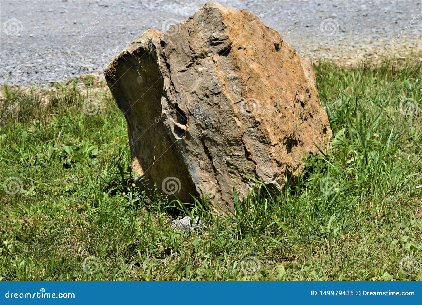 Centered Large Brown Tan Square Rock in Front of Gravel Path Stock ...