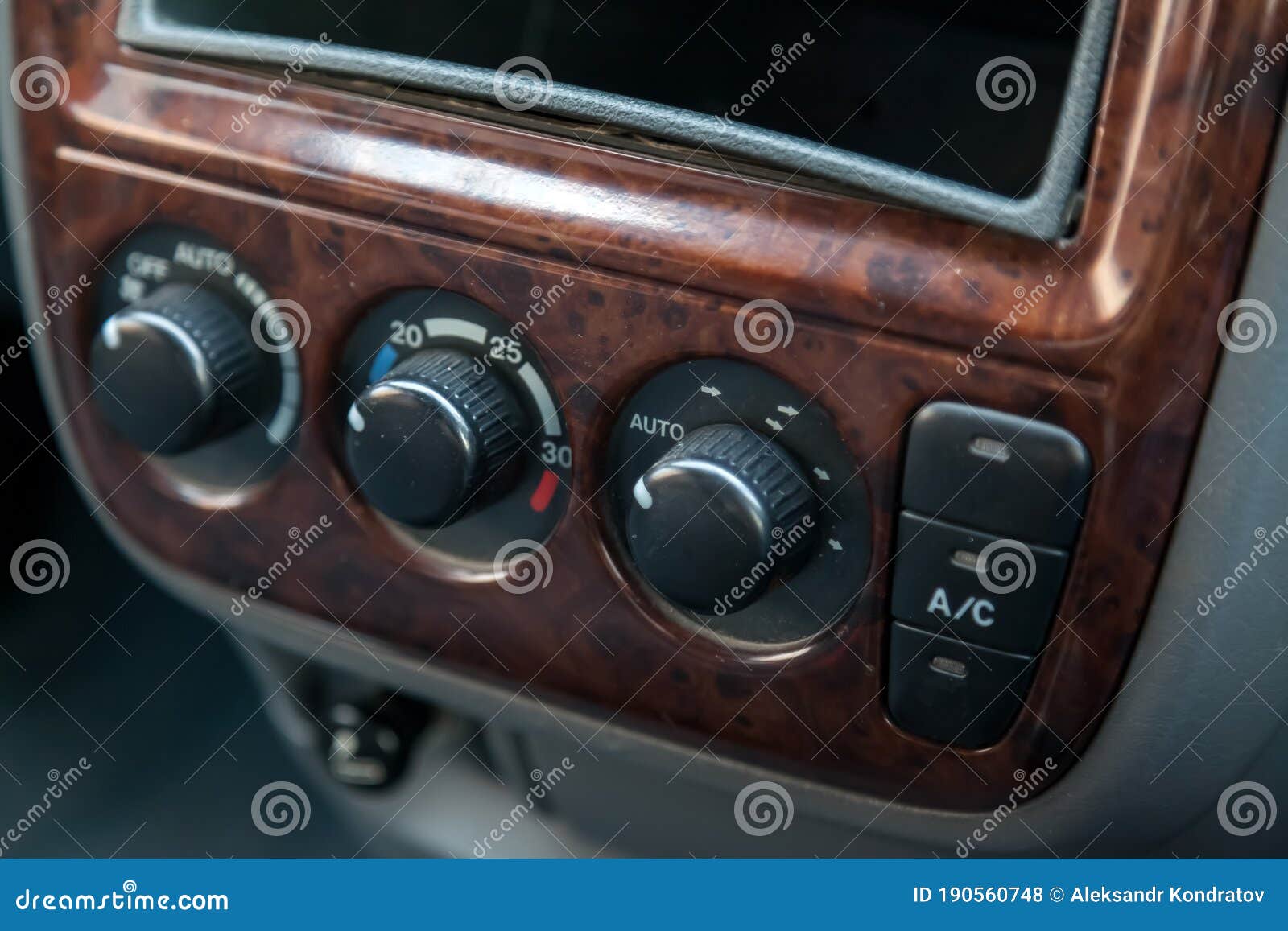 The Central Control Console on a Brown Decorated Panel Inside the Car ...