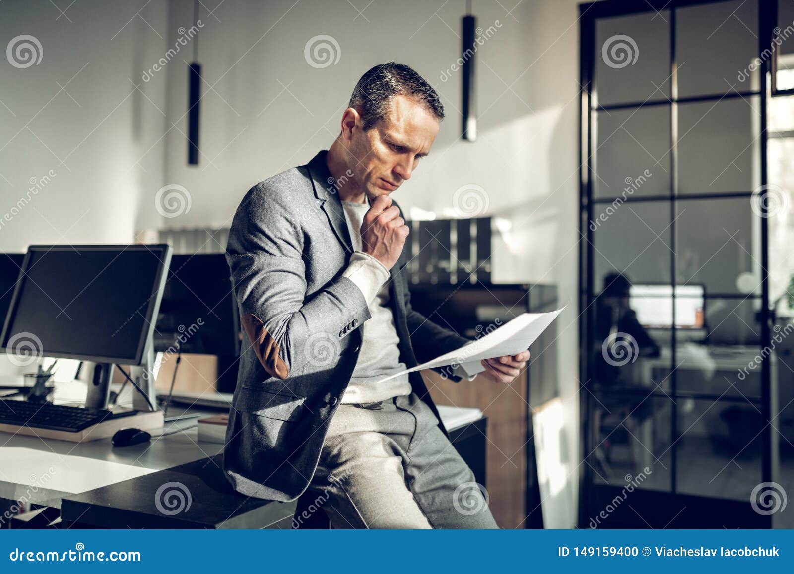 CEO of the Company Feeling Thoughtful while Reading the Documents Stock ... CEO of the Company Feeling Thoughtful while Reading the Documents Stock ...
