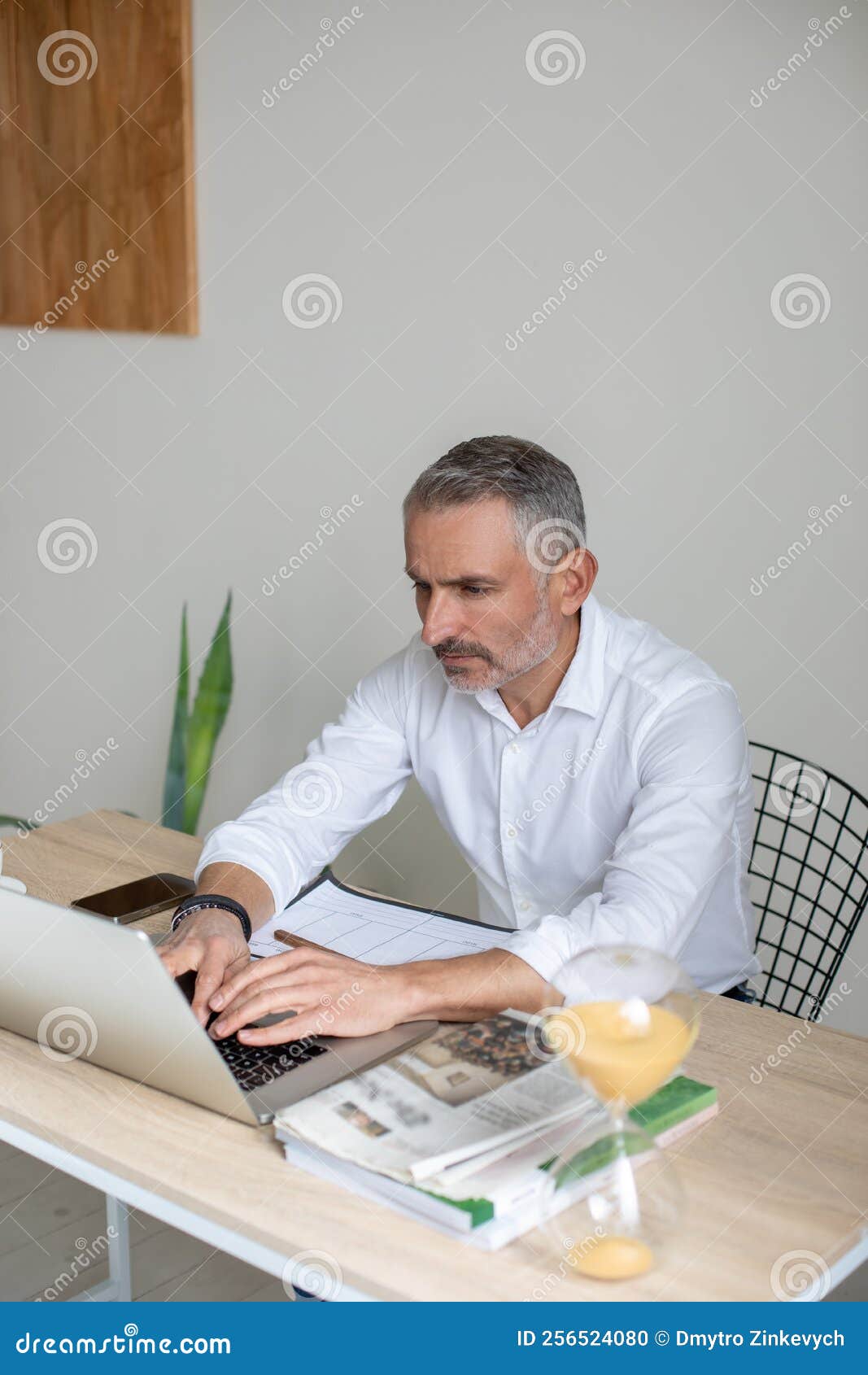 CEO Sitting at His Working Place and Working on the Laptop Stock Photo ...