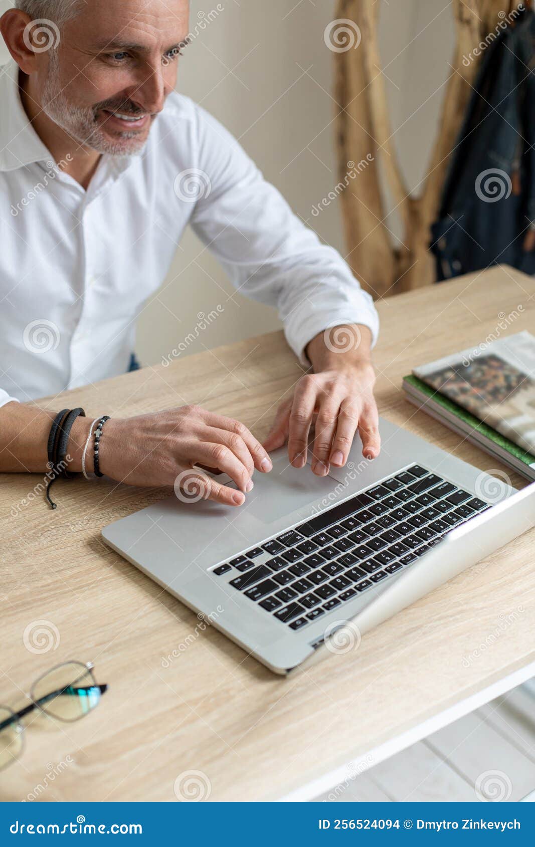 CEO Sitting at His Working Place and Working on the Laptop Stock Photo ...
