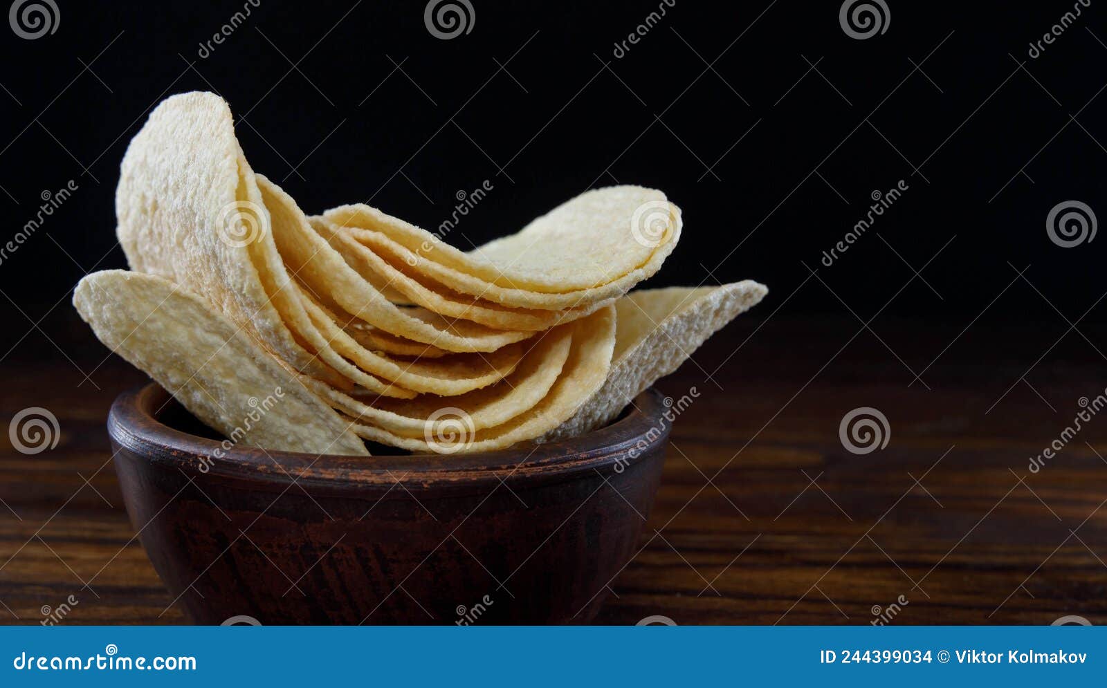 A Ceramic Cup of Chips Stands on the Surface of the Table Stock Photo ...