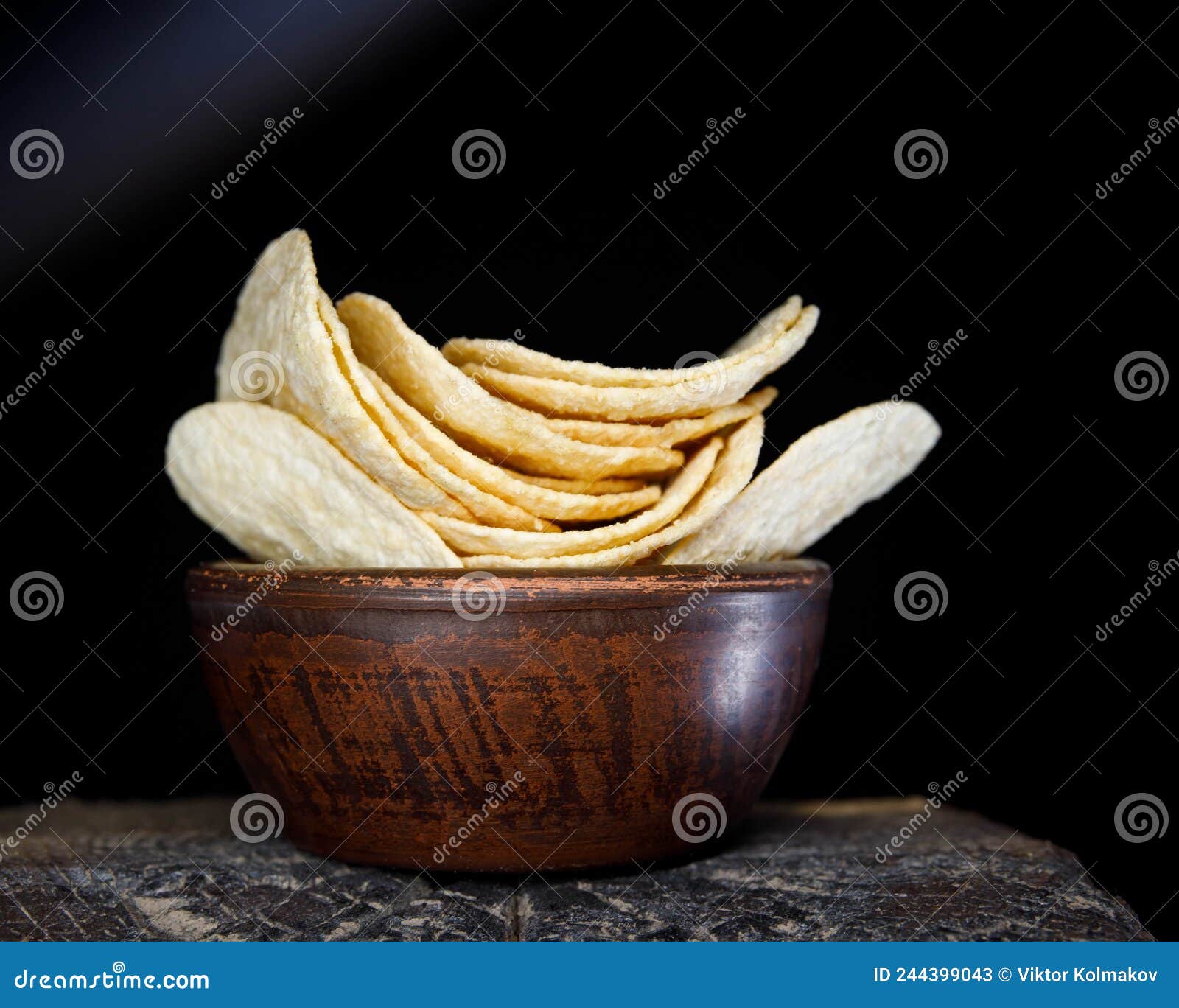 A Ceramic Cup of Chips Stands on the Surface of the Table Stock Image ...