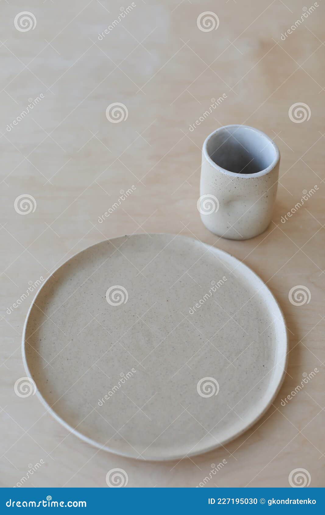 Ceramic Cup and Plates on a Wooden Table Top View. Minimalist Set of ...