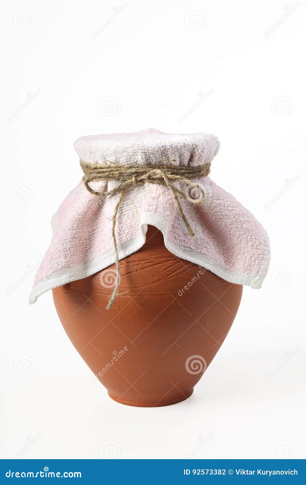 A Ceramic Jug Covered with a Cloth Napkin. Isolated on a White ...