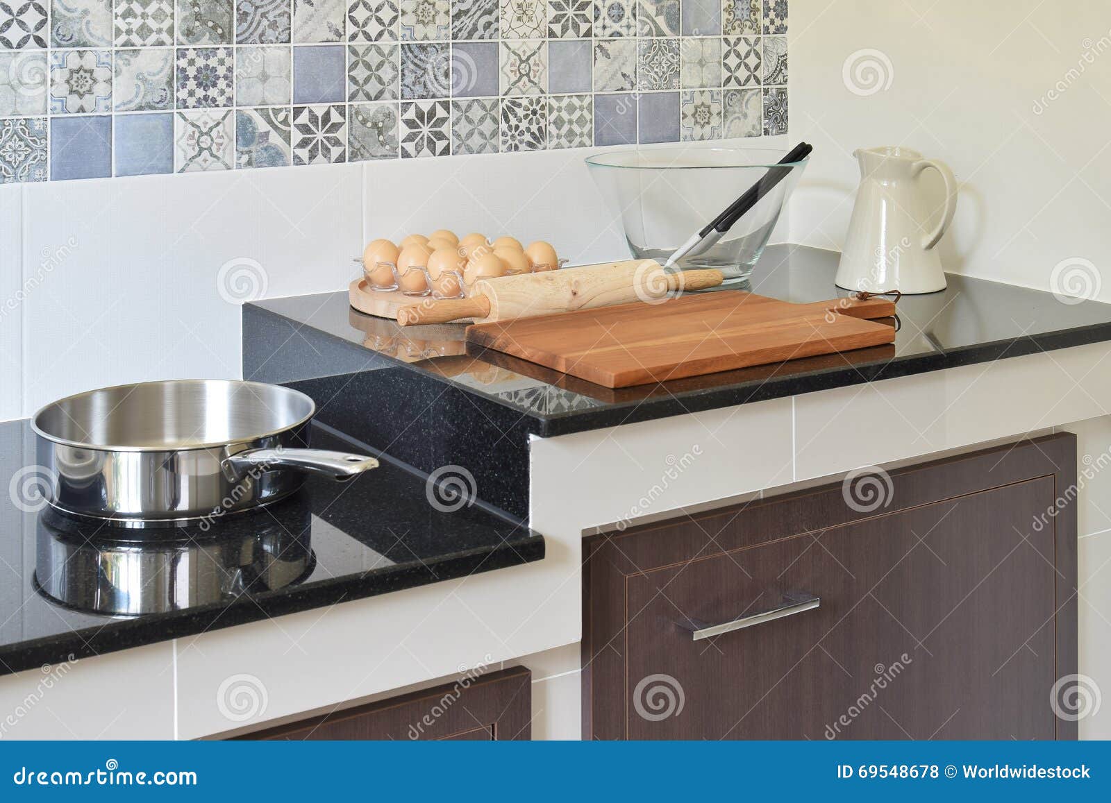 Ceramic Kitchenware and Utensils on the Black Granite Counter Top Cou ...