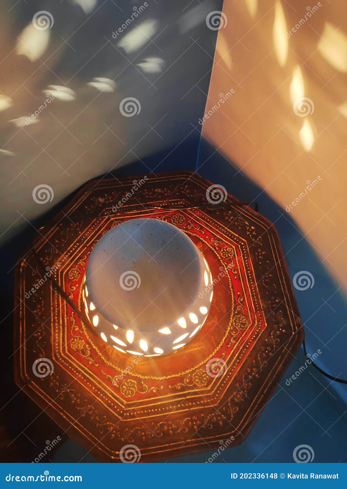 The Ceramic Lamp with Holes Casting Spotty Light Pattern and Shadow on ...