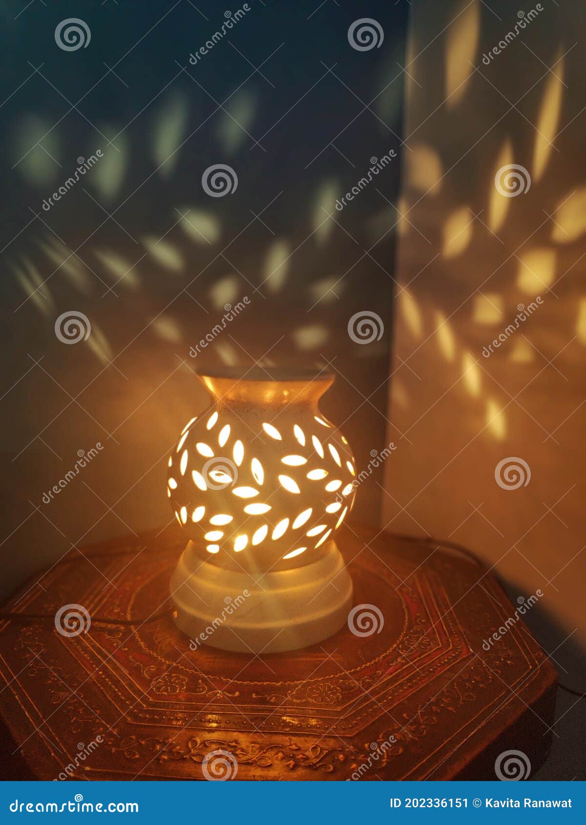 The Ceramic Lamp with Holes Casting Spotty Light Pattern and Shadow on ...