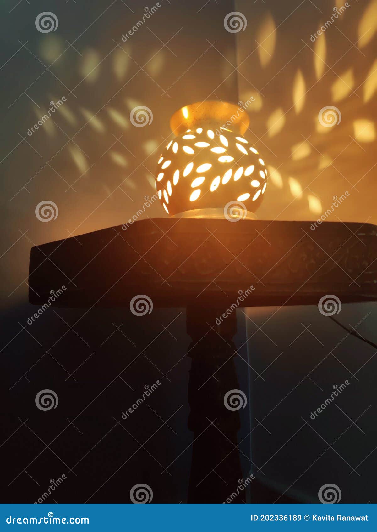 The Ceramic Lamp with Holes Casting Spotty Light Pattern and Shadow on ...