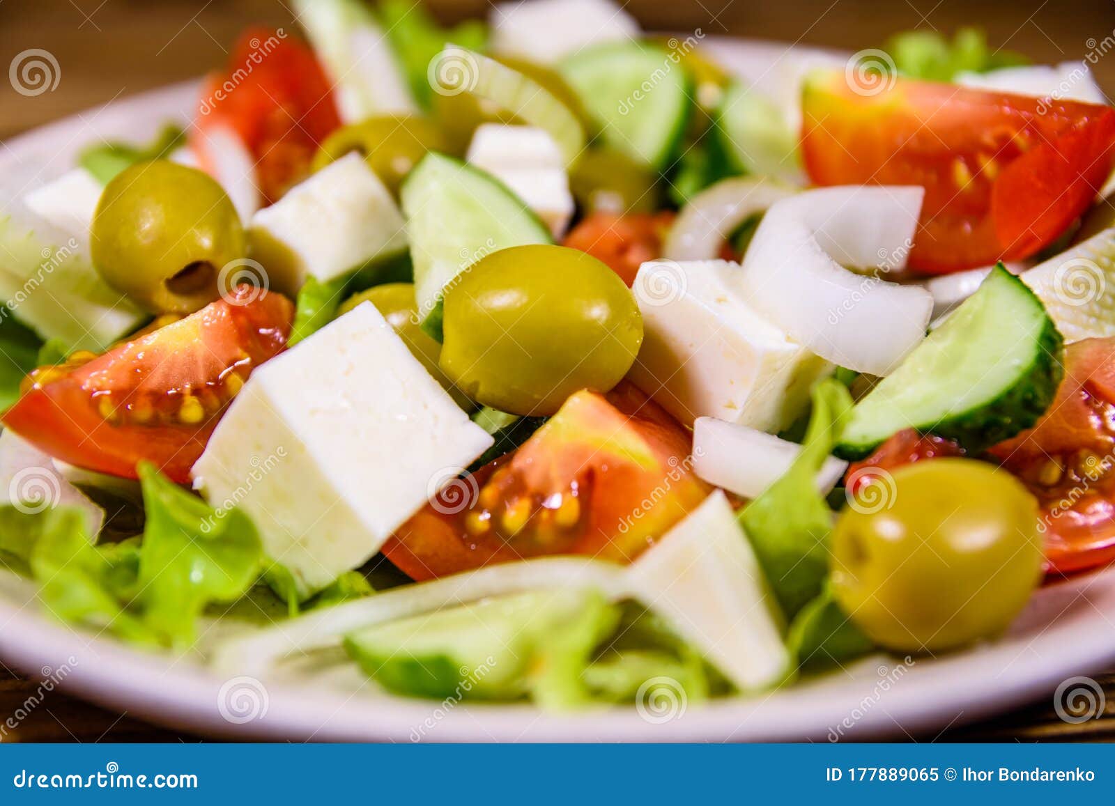 Ceramic Plate with Greek Salad on Wooden Table Stock Image - Image of ...