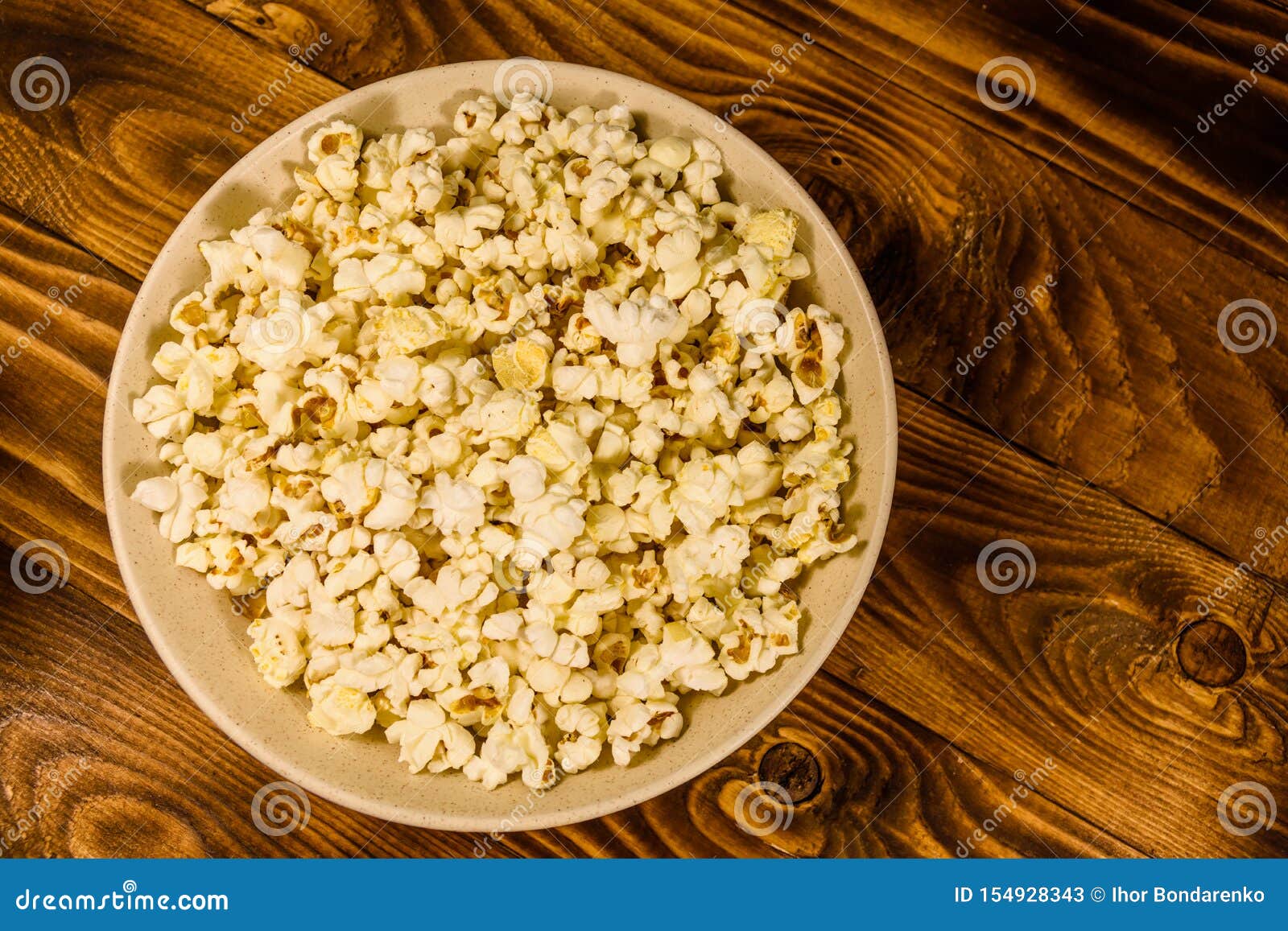 Ceramic Plate with Popcorn on Wooden Table. Top View Stock Image ...