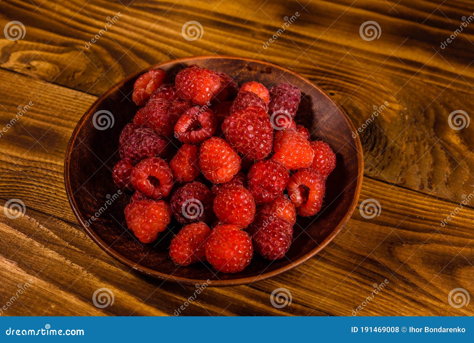 Ceramic Plate with Ripe Raspberries on Wooden Table Stock Photo - Image ...