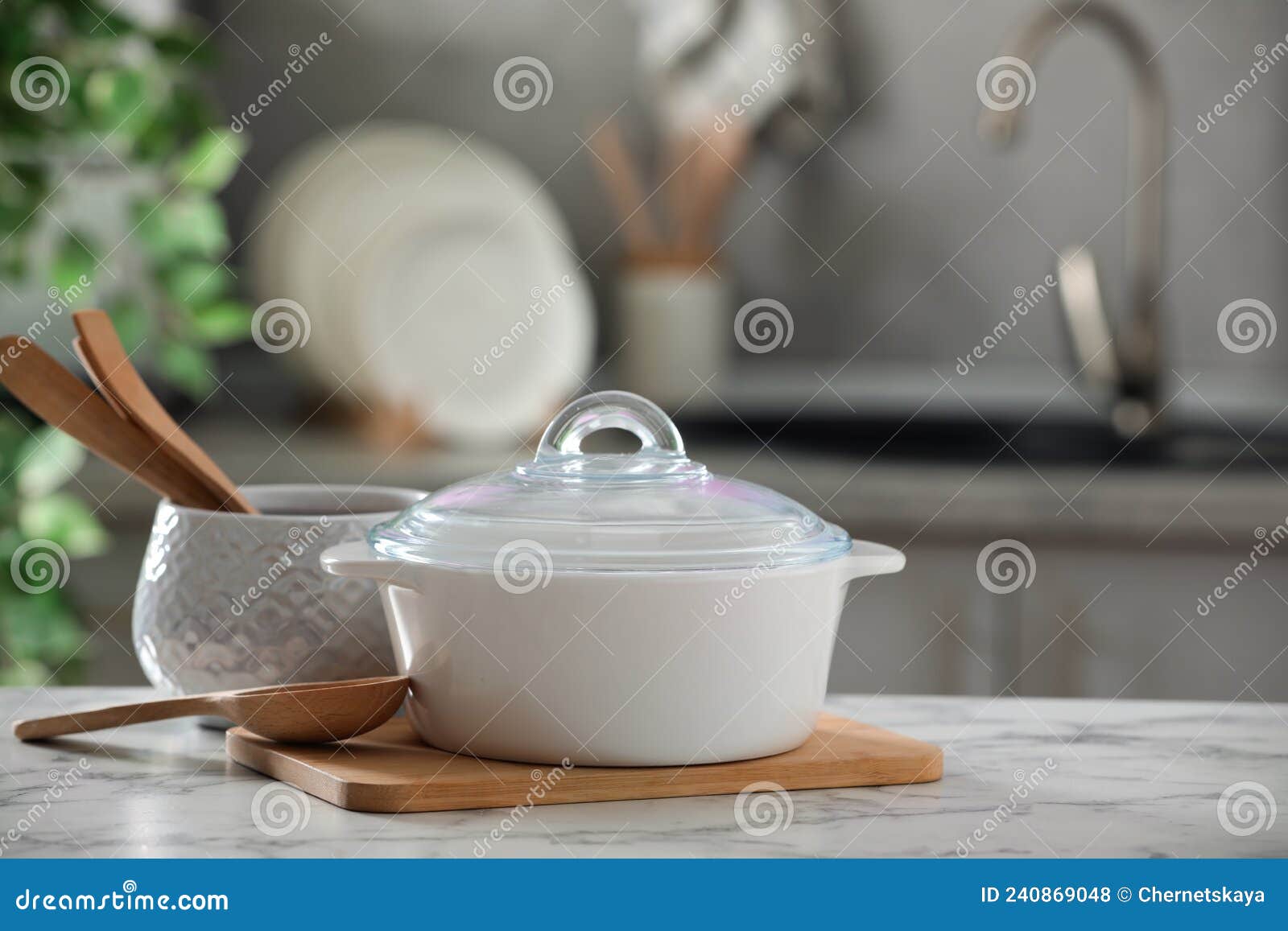 Ceramic Pots and Cooking Utensils on White Marble Table in Kitchen ...