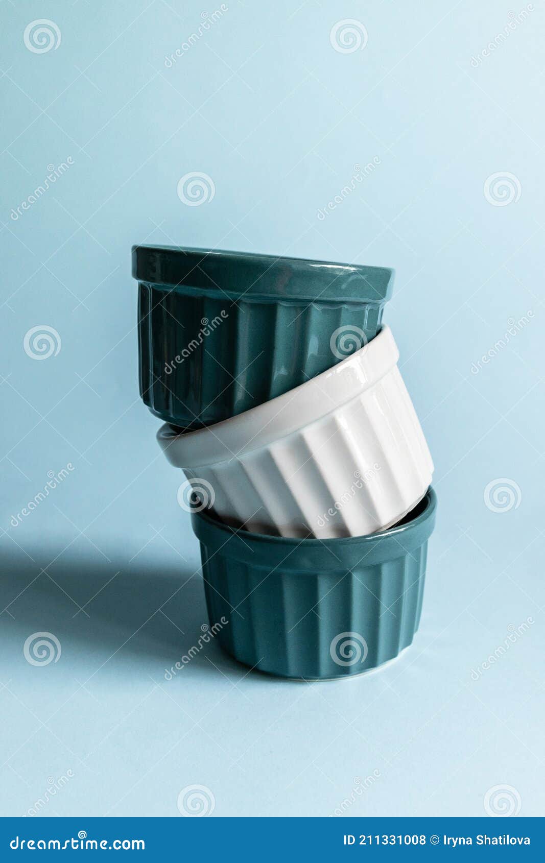 Ceramic Round Ramekins on a Blue Background. Stock Photo - Image of ...