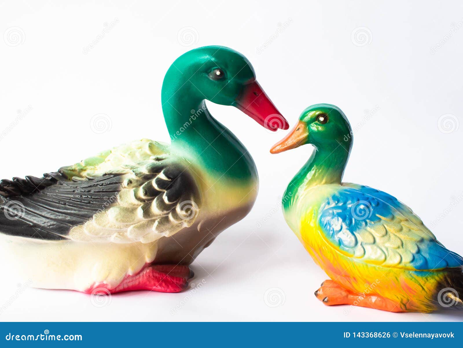 Ceramic Statuette of a Duck on a White Background with Brightly Colored ...