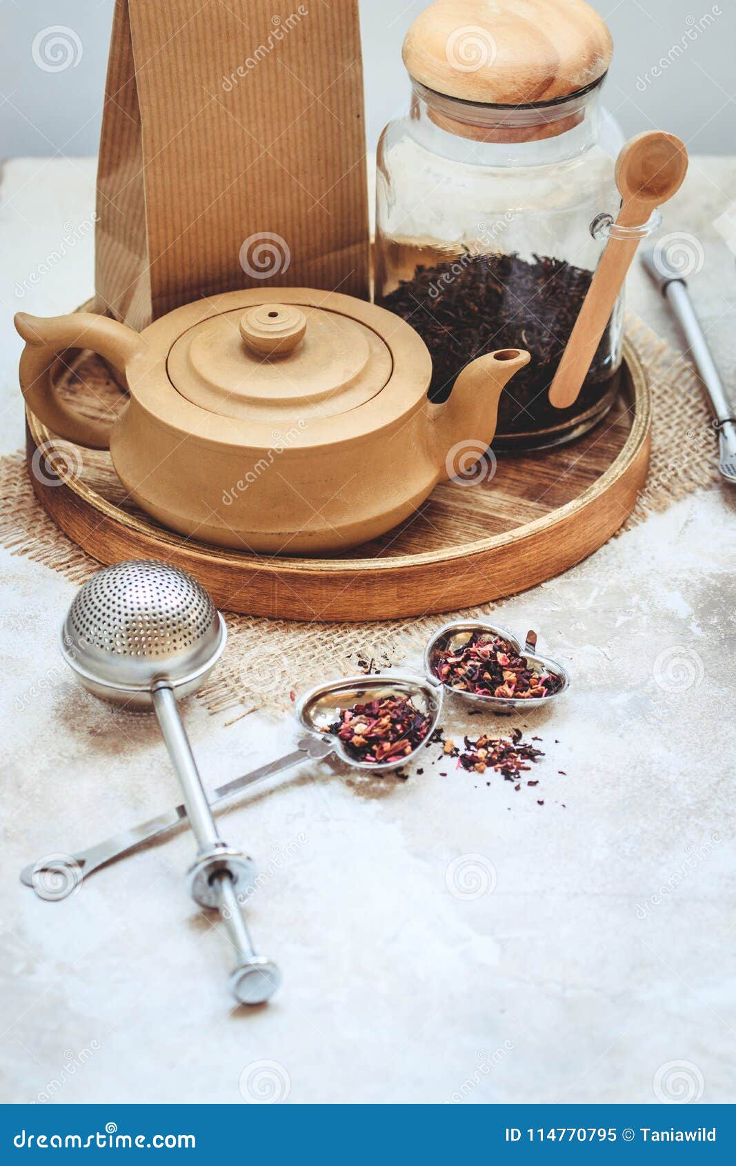 Ceramic Tea Pot, Metal Tea Infuser and Cup of Black Tea. Composition ...