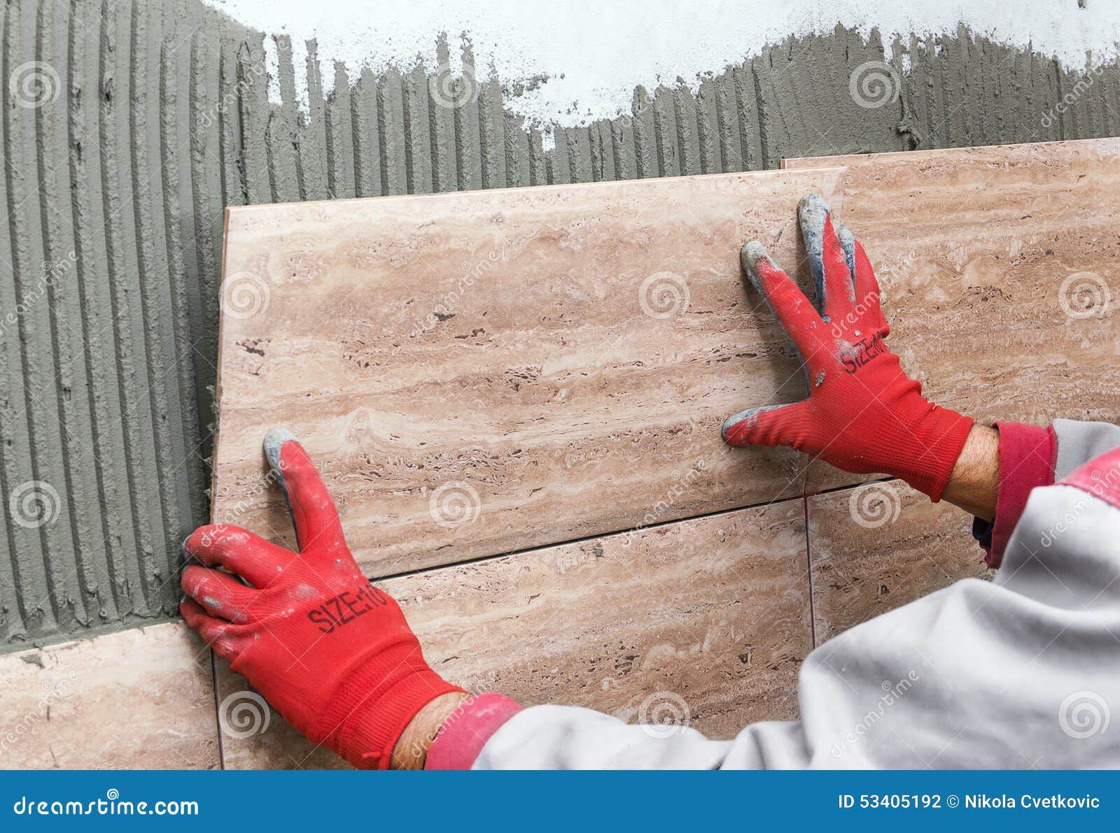 Ceramic Tiles. Tiler Placing Ceramic Wall Tile in Position Over Stock ...
