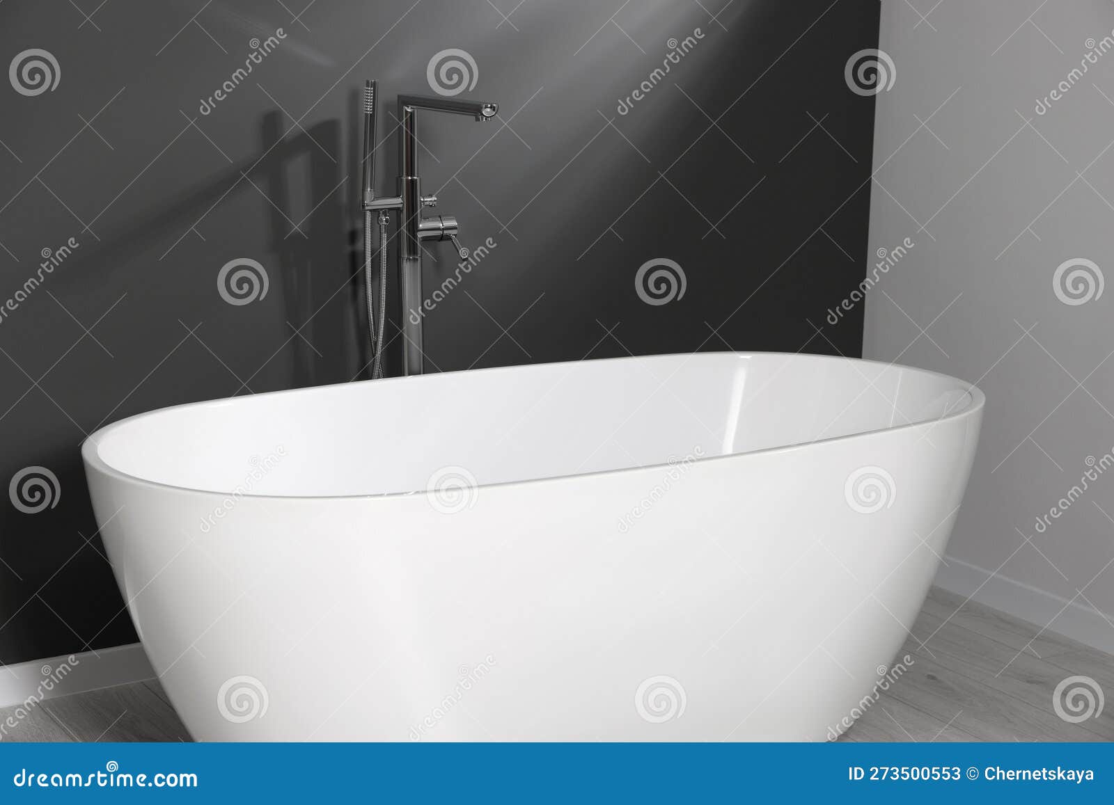 Stylish Ceramic Tub Near Grey Wall in Bathroom Stock Image - Image of ...