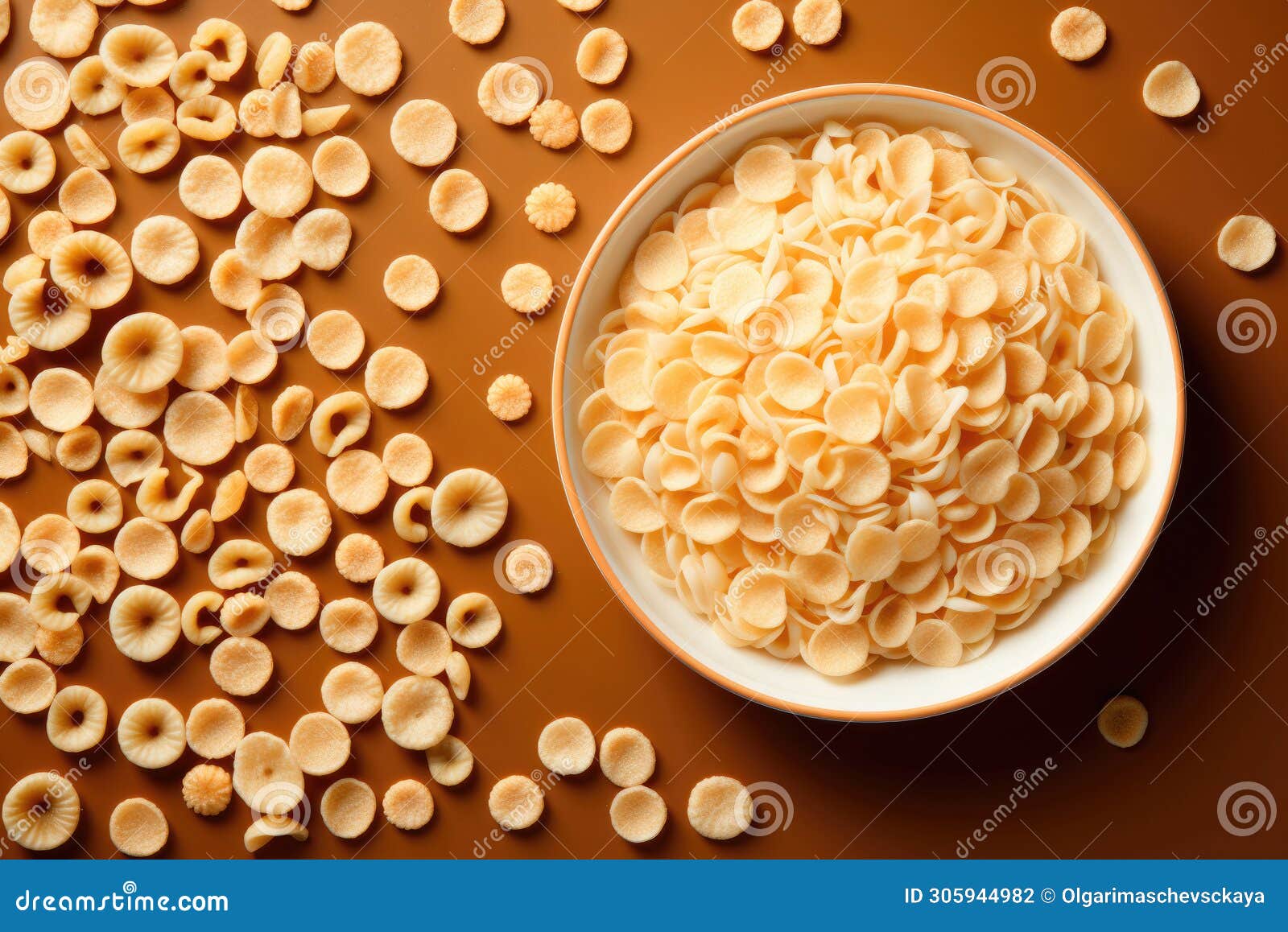 Cereal Flakes on a Brown Background Scattered and in a Bowl Stock ...