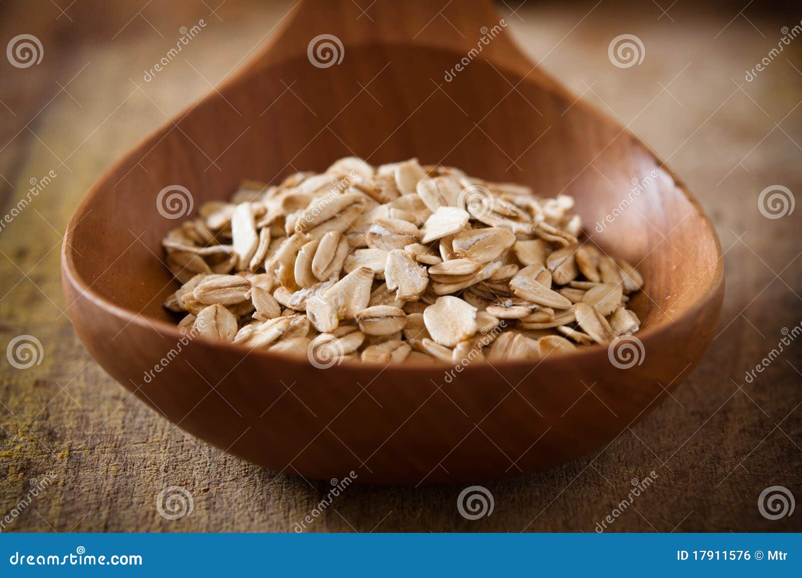 Cereal in a wooden spoon stock photo. Image of colorful - 17911576
