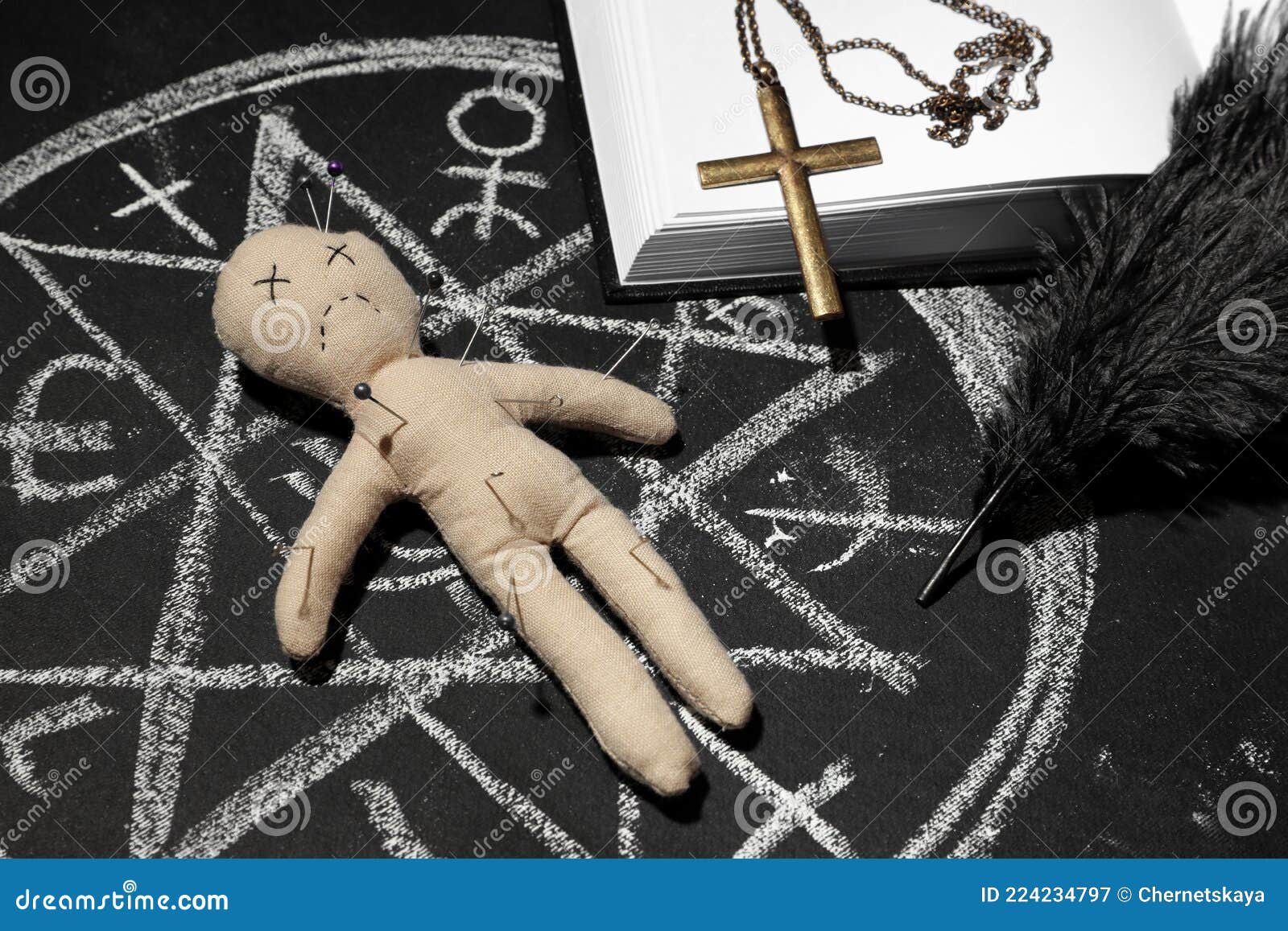 Ceremonial Items and Voodoo Doll in Ritual Circle Drawn on Black Table ...