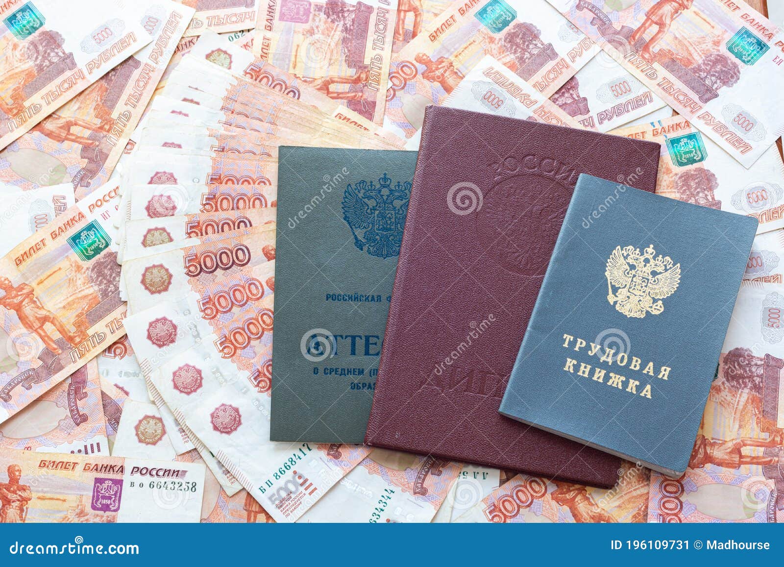 A Certificate, a Red Diploma and a Work Book are on the Five Thousandth ...