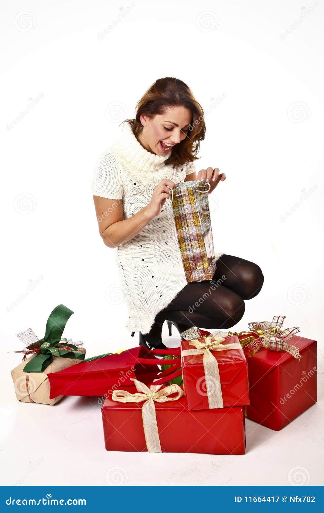 Chacking Out the Presents stock image. Image of adult - 11664417