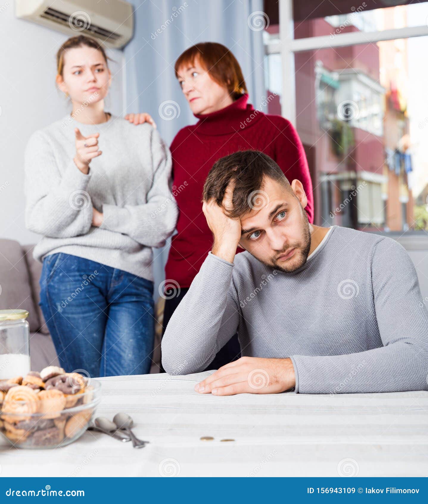 Chagrined Guy Having Problems in Relationship with Family Stock Image ...