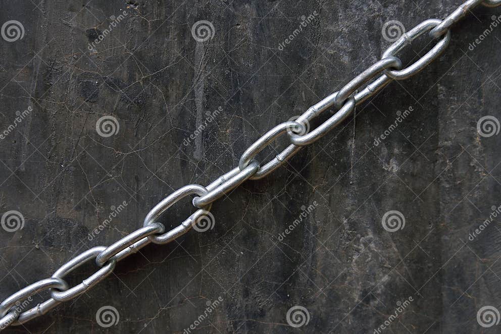 Chain on gray wall stock image. Image of interior, closeup - 31487239