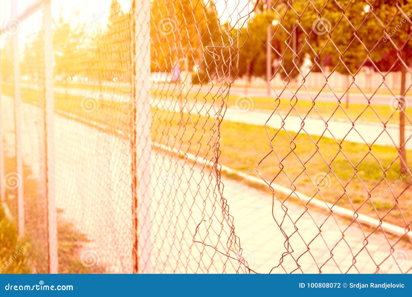 Chain Link Wire Fence with Hole Parallel with the Street and with ...