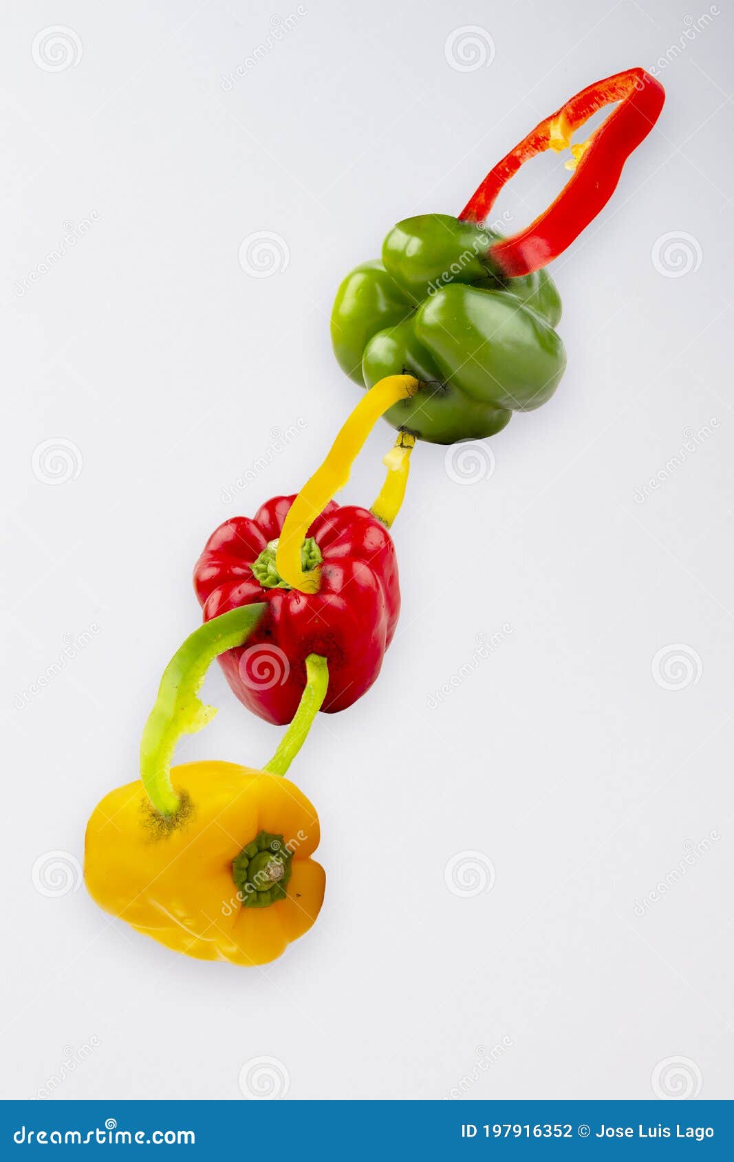 Chain of Peppers Intertwined by Same Vegetable Rings Stock Photo ...