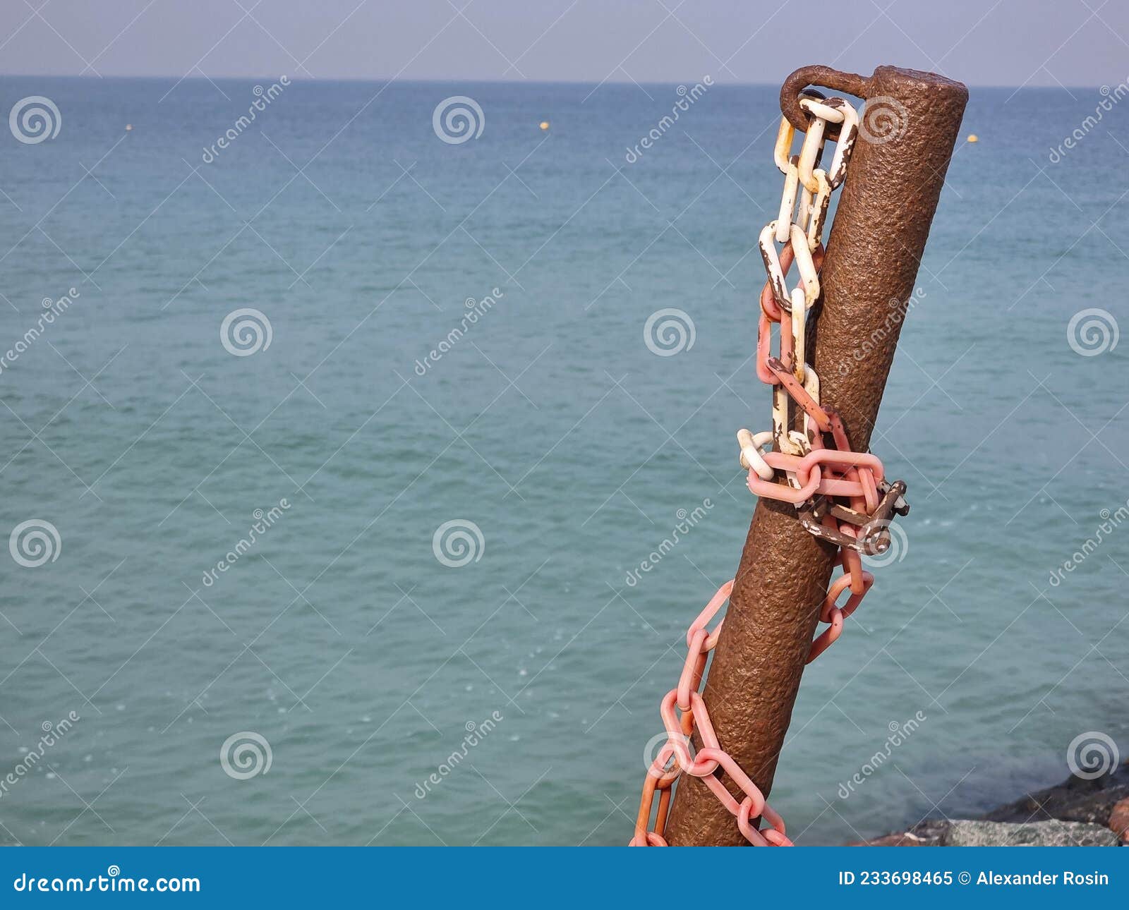 A Chain Round a Pillar on a Coastline Stock Image - Image of wood ...