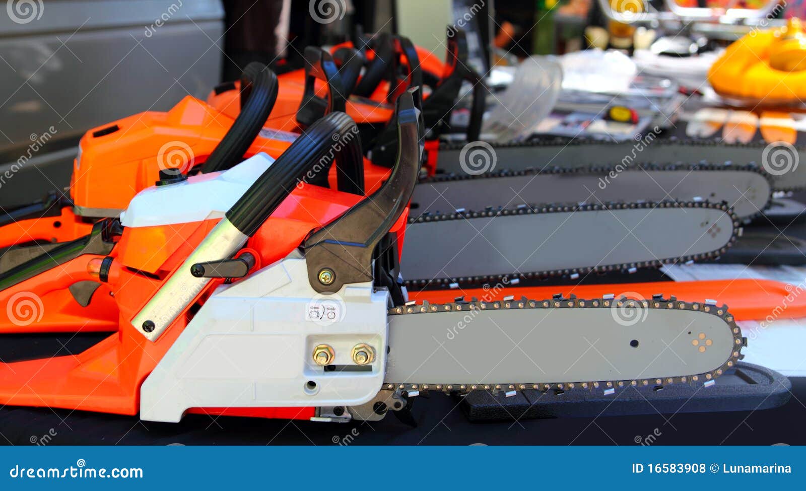 Chain Saw Machines Row Perspective in Market Stock Photo - Image of ...