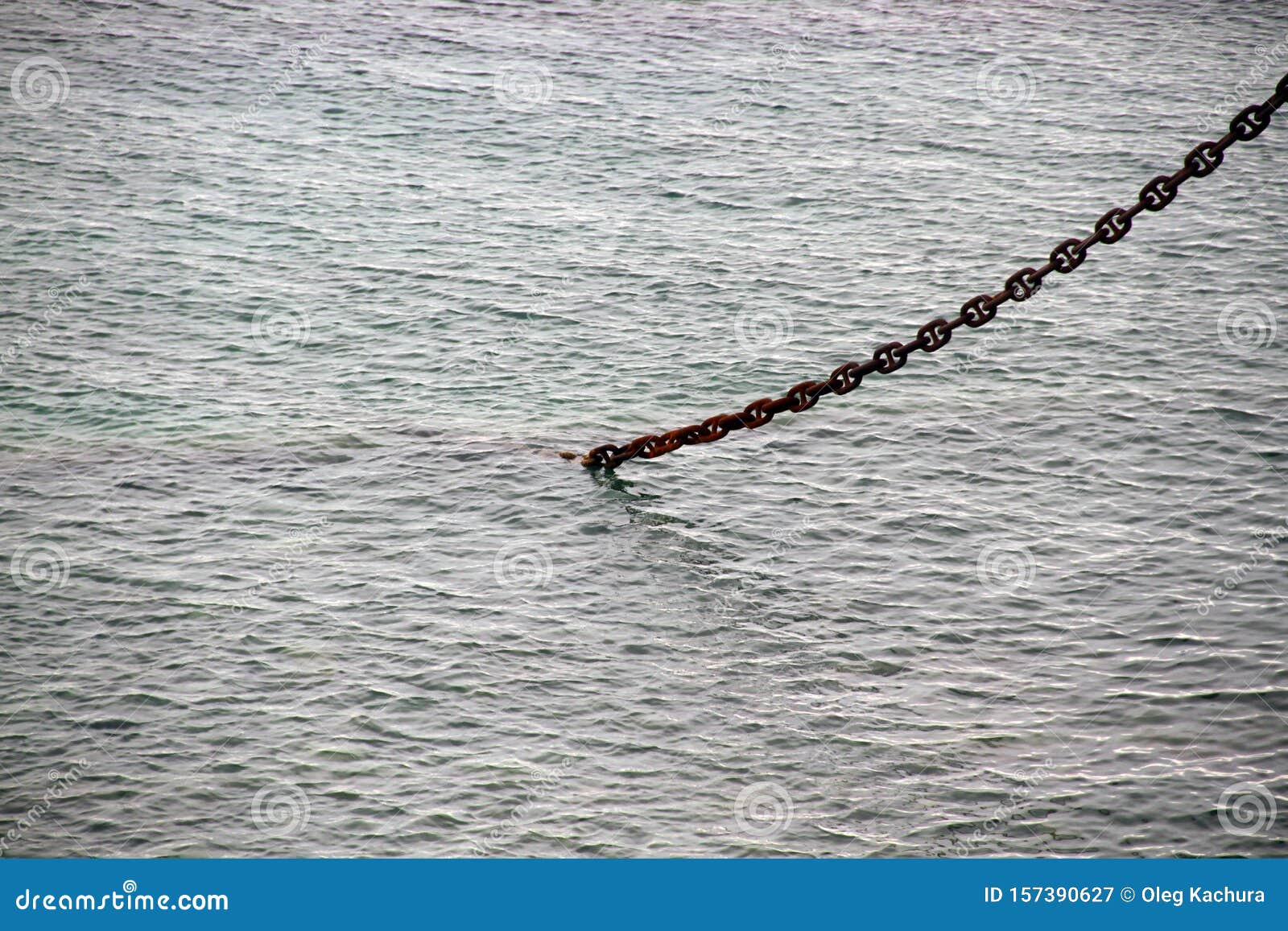 The Chain from the Ship`s Anchor Going into the Depths of the Sea Stock ...