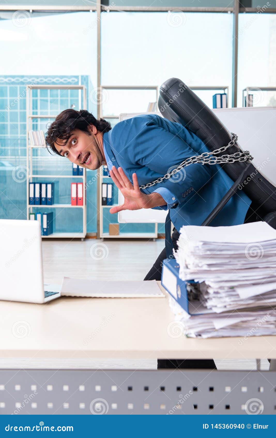 The Chained Male Employee Unhappy with Excessive Work Stock Photo ...