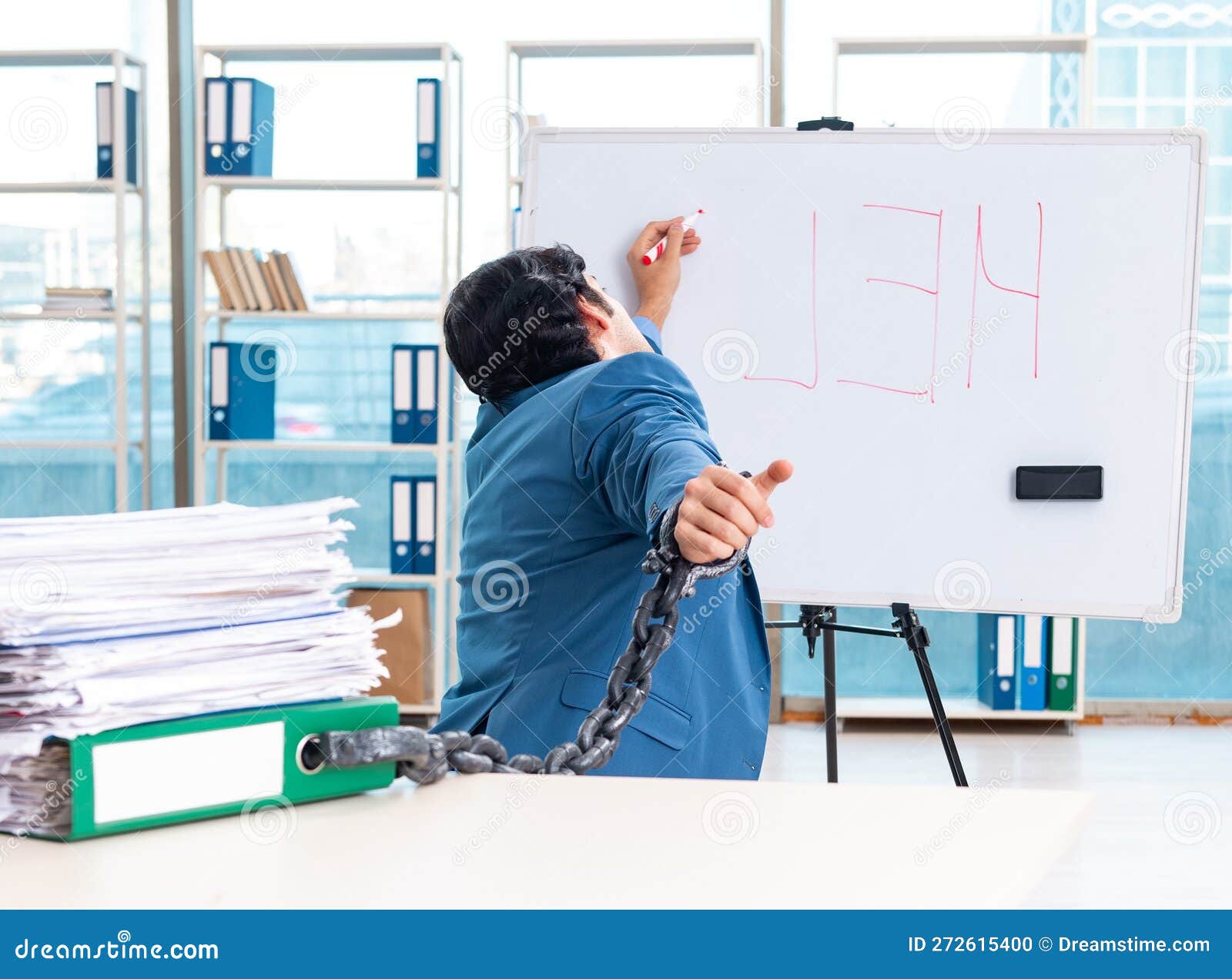 Chained Male Employee Unhappy with Excessive Work Stock Photo - Image ...