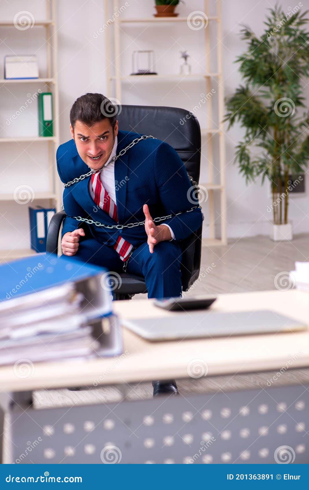 Chained Male Employee Working in the Office Stock Image - Image of ...
