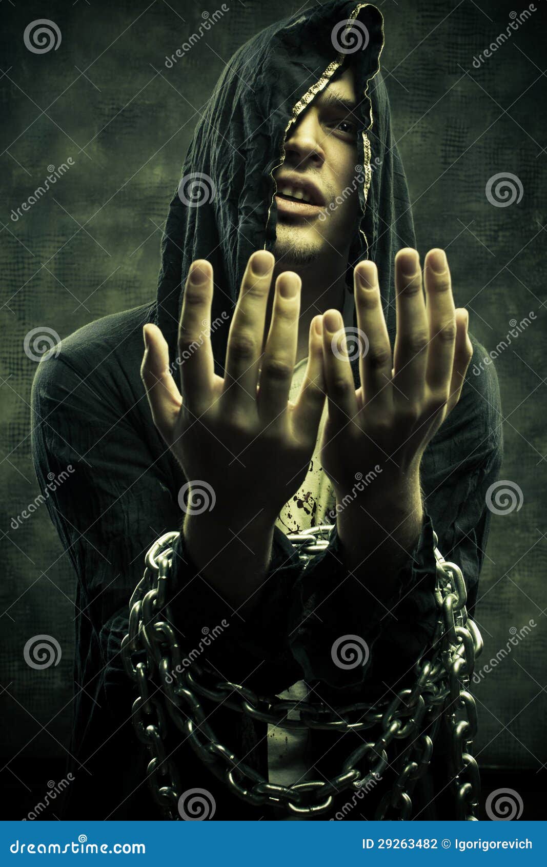 Chained miserable cultist stock photo. Image of hood - 29263482
