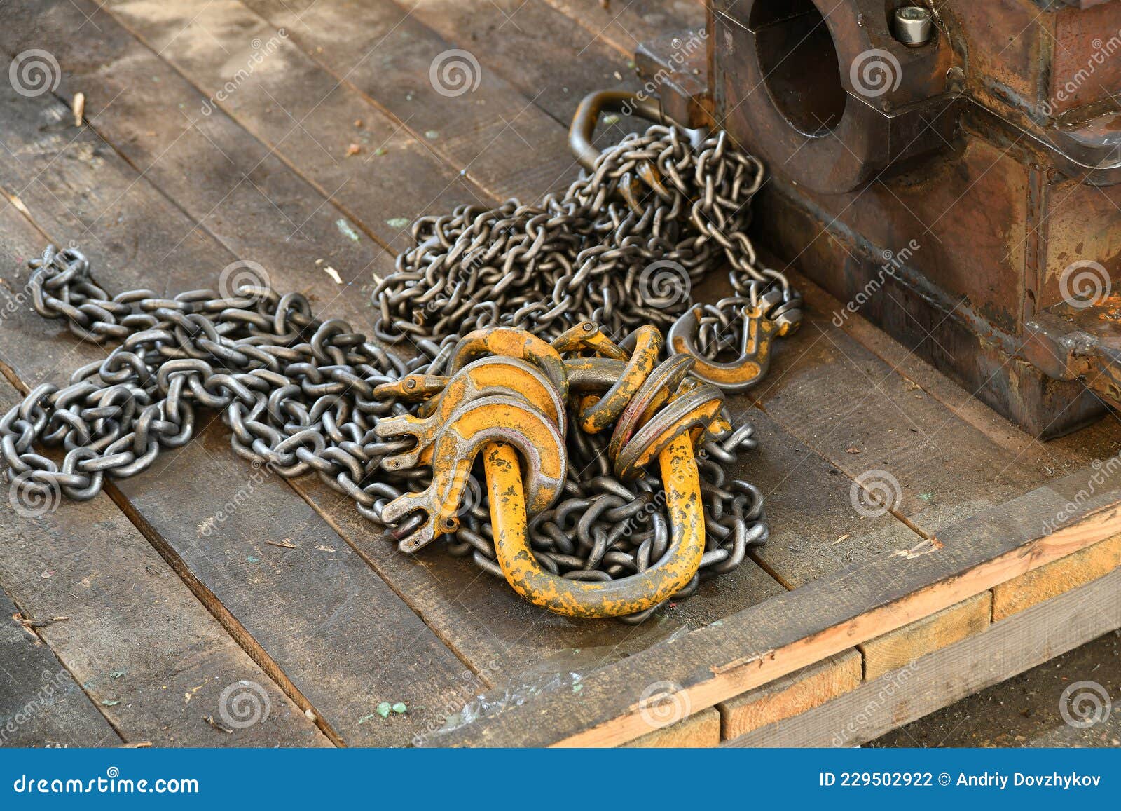 Chains with Hooks for Lifting Loads on the Telpher Crane Lie on a ...