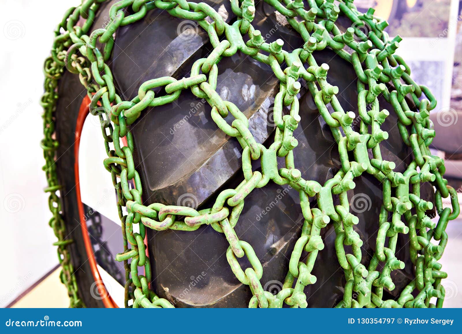 Chains on tractor wheel stock image. Image of equipment - 130354797