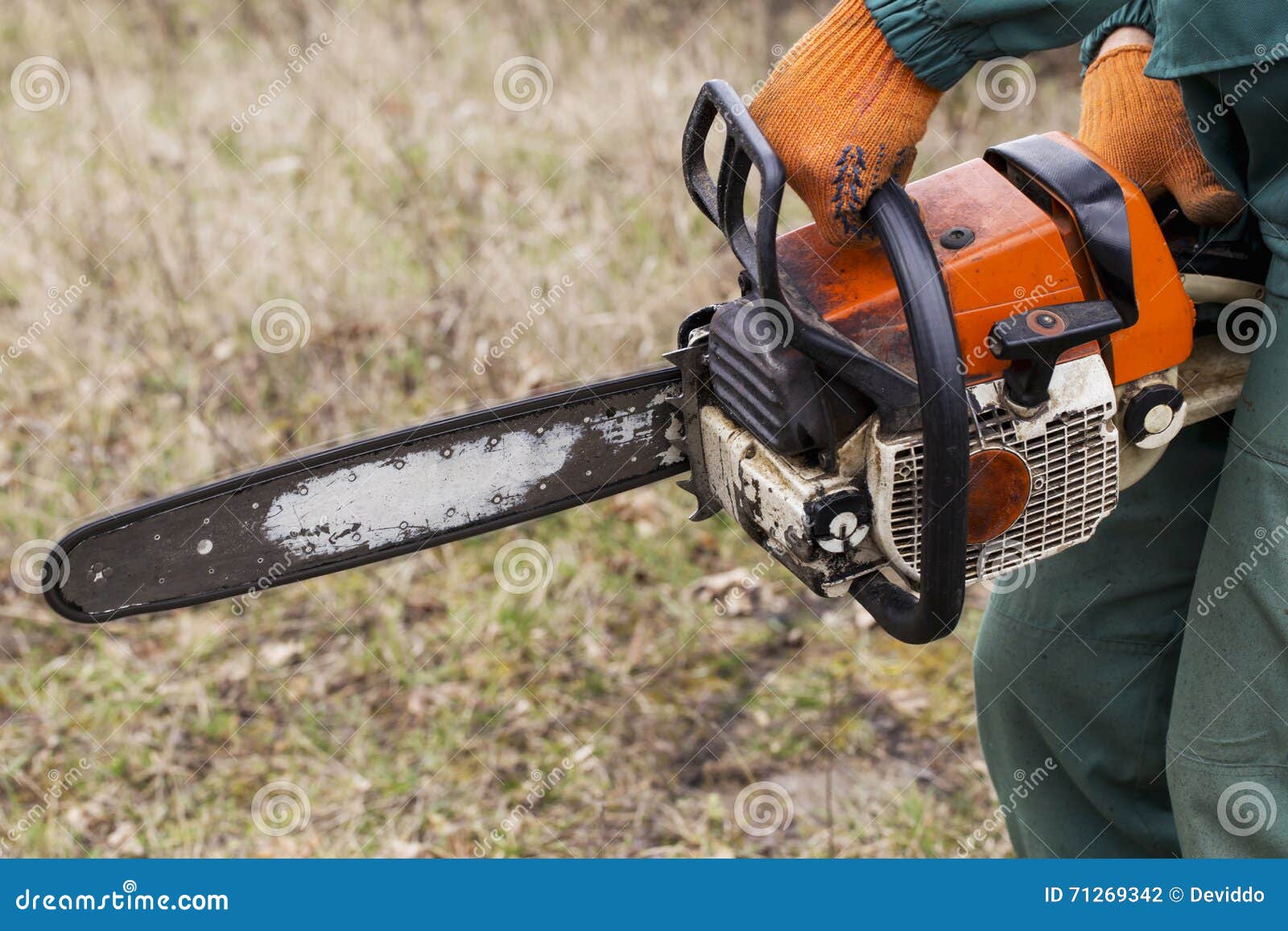 Chainsaw in a hands stock photo. Image of hands, chain - 71269342